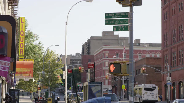 125th Street sign - cars and bus driving in street in Harlem - uptown ...