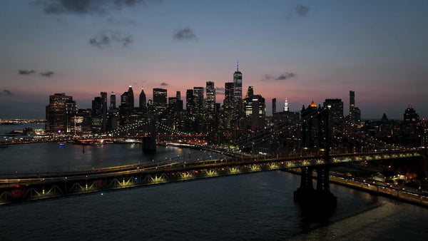 aerial over East River water Brooklyn Bridge two bridges Manhattan sky ...