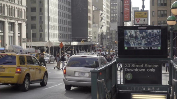 33rd Street downtown subway station entrance, people crossing street i ...