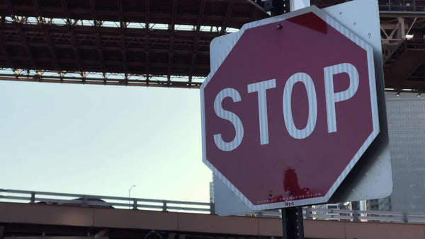 red stop sign by Brooklyn Bridge entrance on Lower East Side Downtown ...